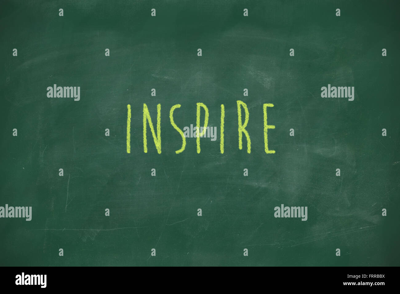 Inspire handwritten on school blackboard Stock Photo - Alamy