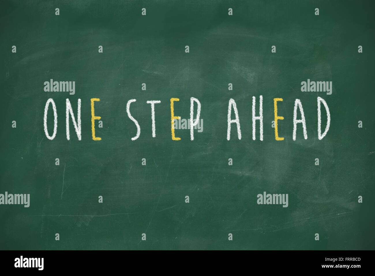One step ahead handwritten on school blackboard Stock Photo - Alamy