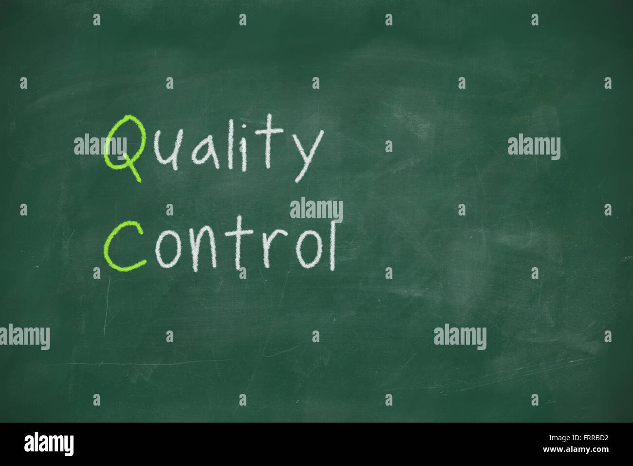 Quality control handwritten on school blackboard Stock Photo - Alamy