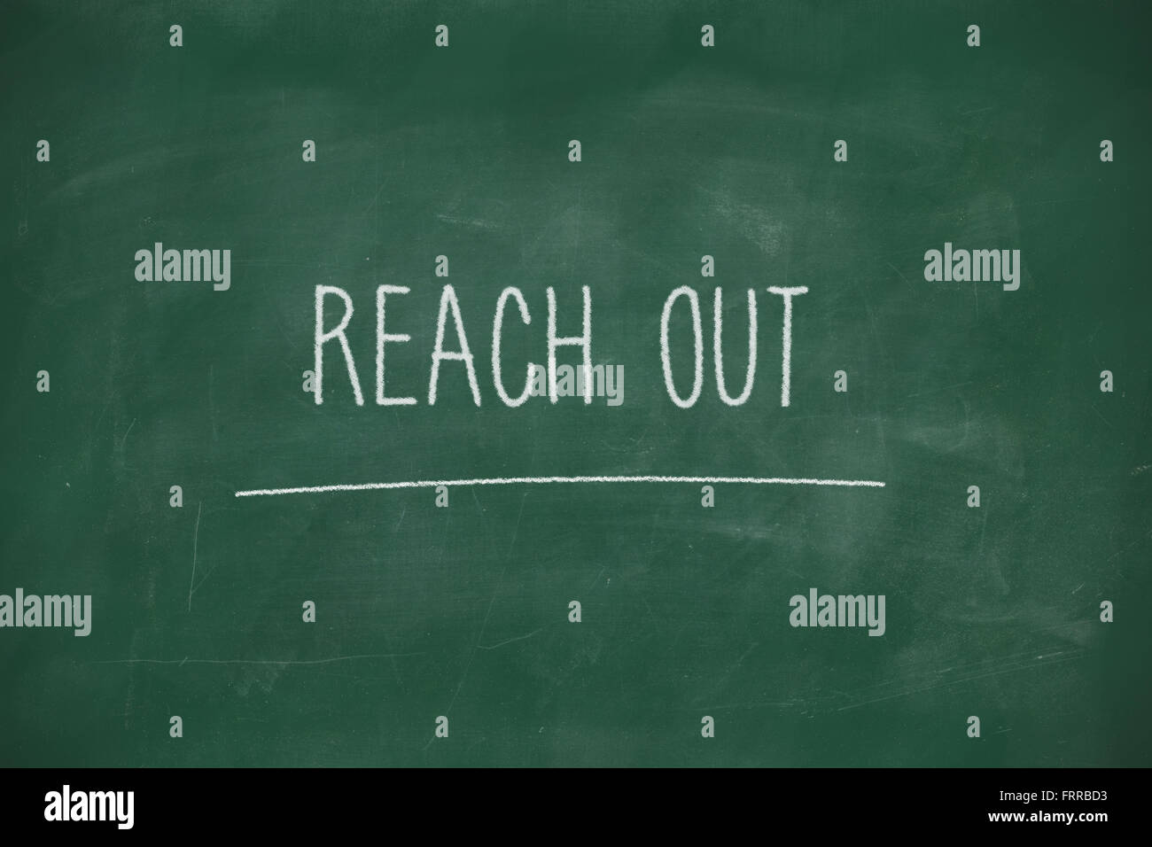 Reach out handwritten on school blackboard Stock Photo - Alamy