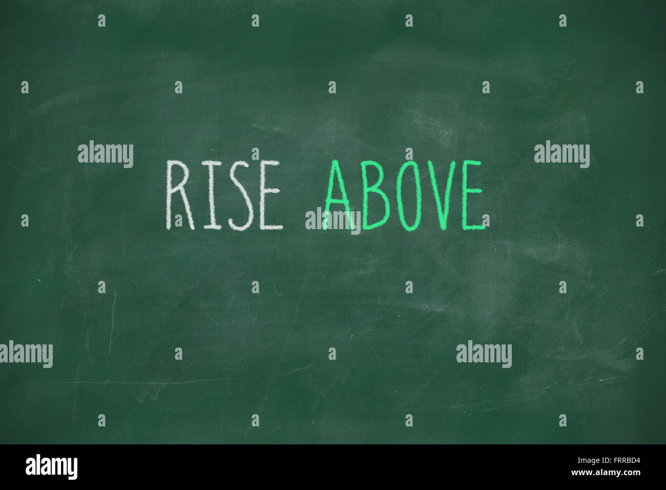 Rise above handwritten on school blackboard Stock Photo - Alamy