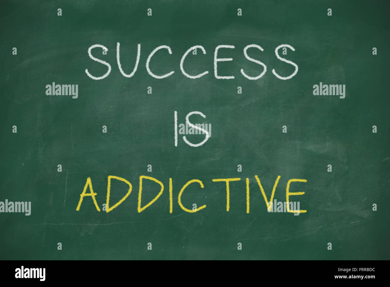 Success is addictive handwritten on school blackboard Stock Photo - Alamy