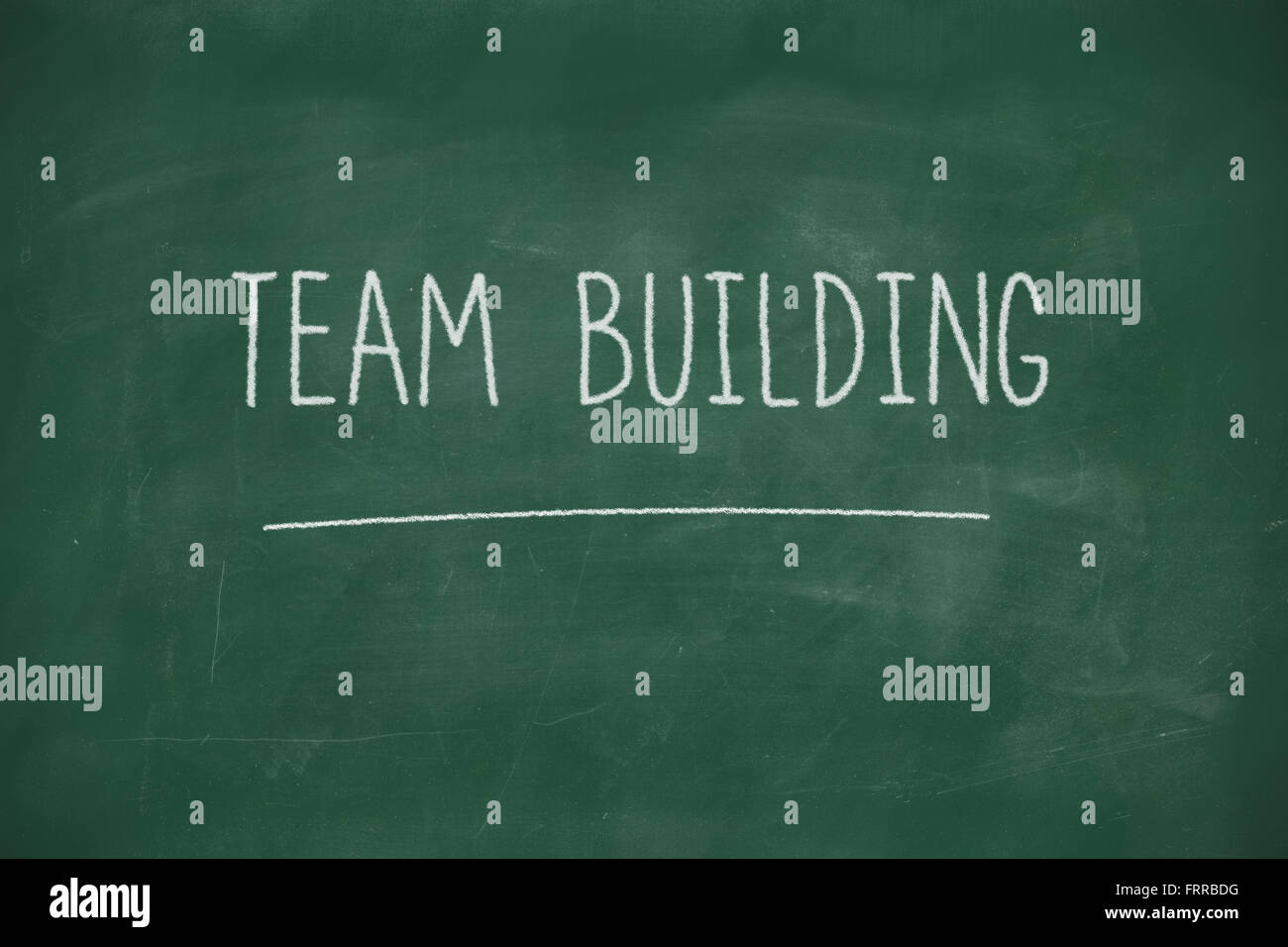 Team building handwritten on school blackboard Stock Photo - Alamy