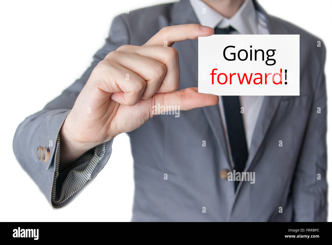 Going forward. Businessman in suit with a black tie showing or holding ...