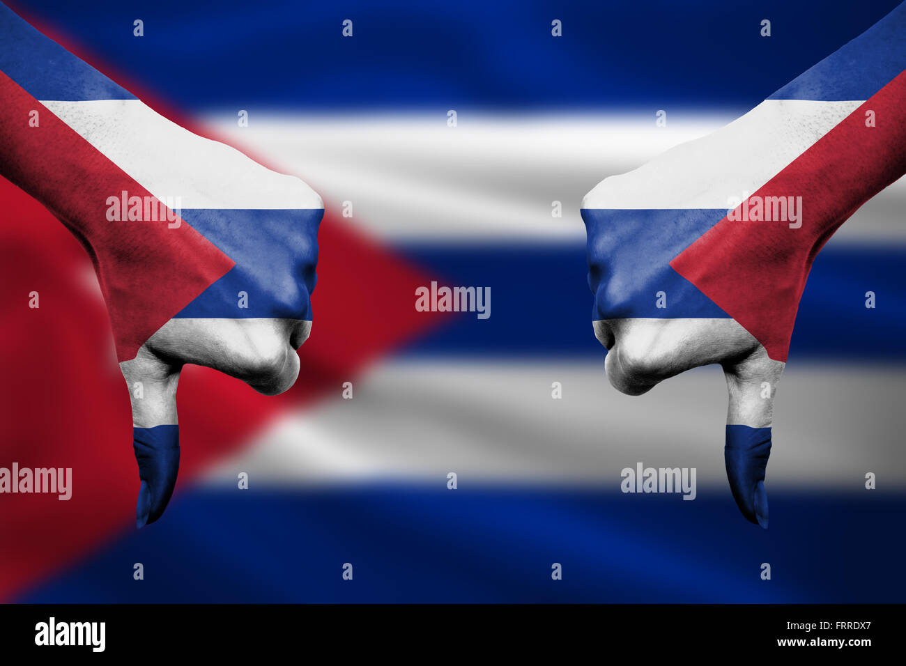 failure of Cuba - hands gesturing thumbs down in front of flag Stock ...