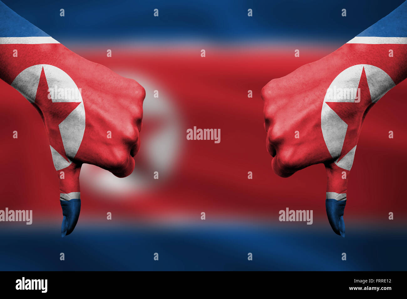 failure of North Korea - hands gesturing thumbs down in front of flag ...