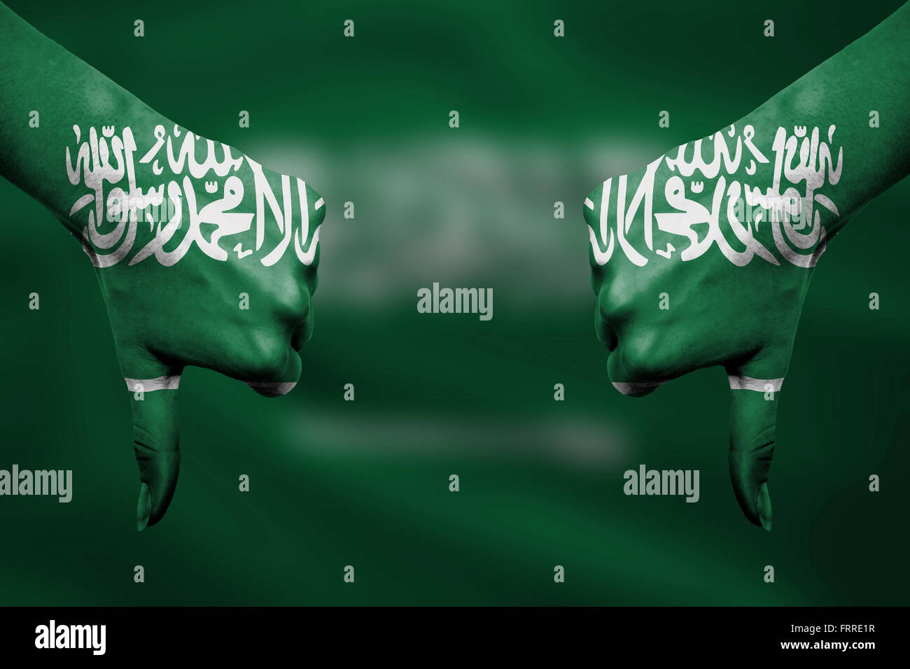 failure of Saudi Arabia - hands gesturing thumbs down in front of flag ...