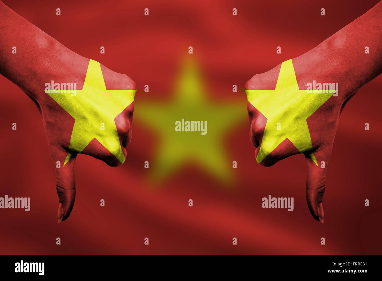 failure of Vietnam - hands gesturing thumbs down in front of flag Stock ...