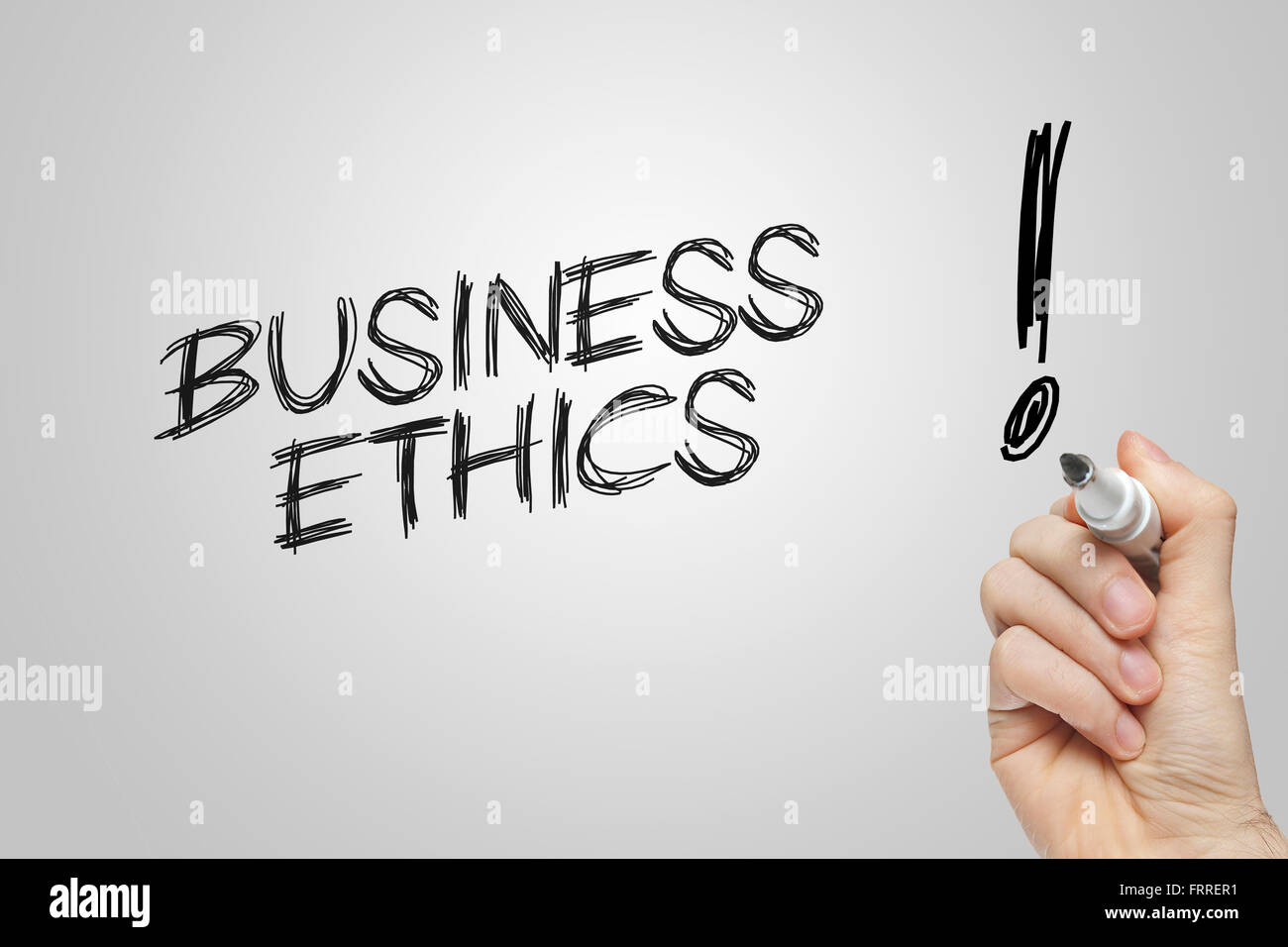 Hand writing business ethics on grey background Stock Photo - Alamy