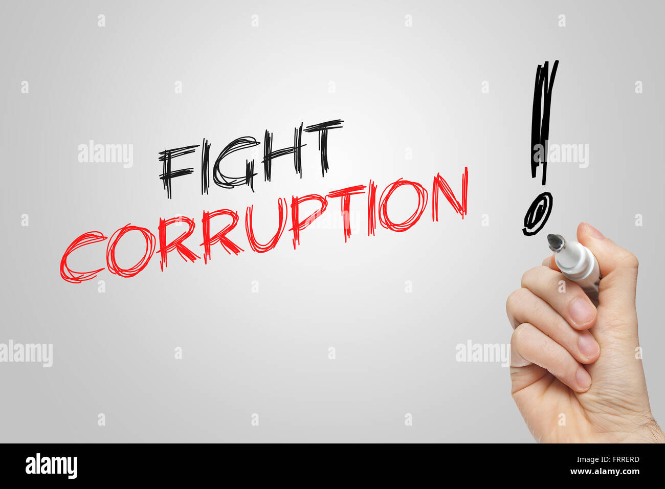 Hand writing fight corruption on grey background Stock Photo - Alamy