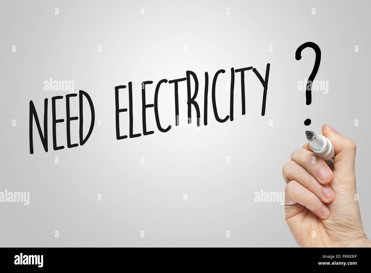 Hand writing need electricity on grey background Stock Photo - Alamy