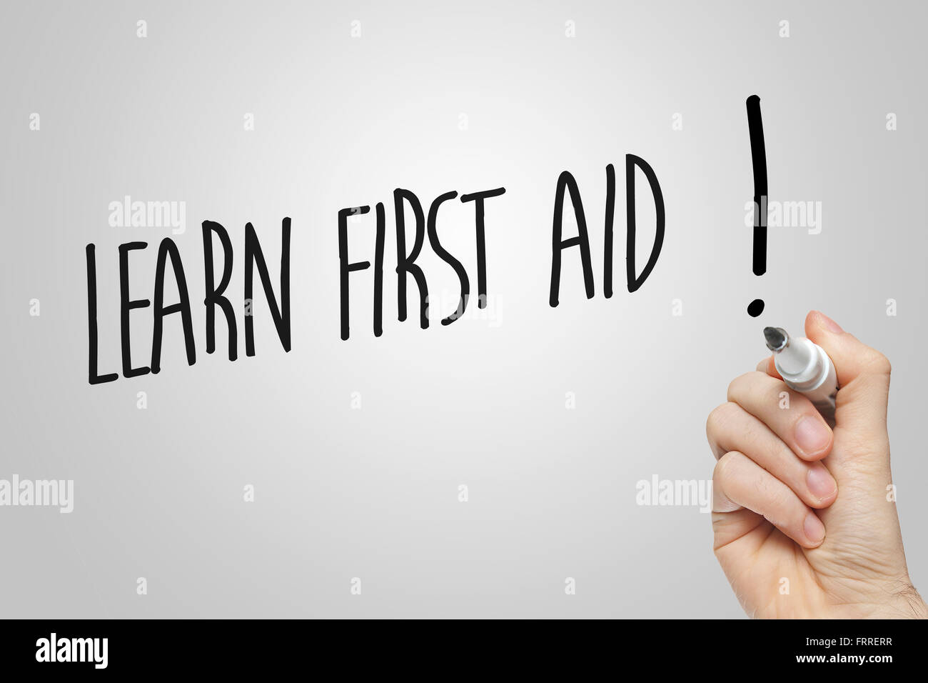 Hand writing learn first aid on grey background Stock Photo - Alamy