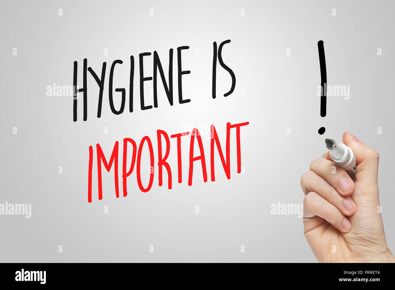 Hand writing hygiene is important on grey background Stock Photo - Alamy