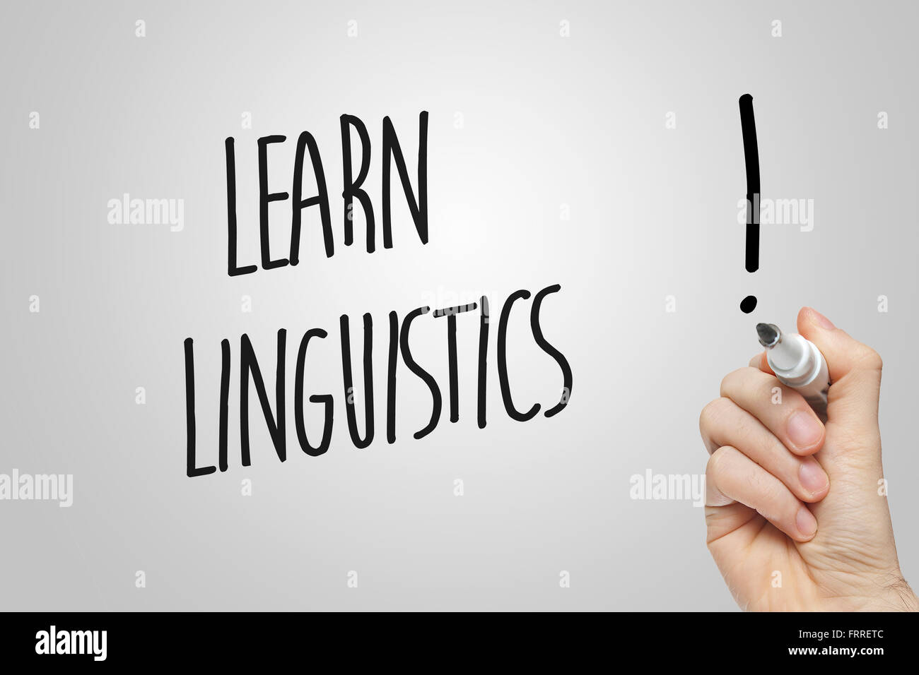 Hand writing learn linguistics on grey background Stock Photo - Alamy