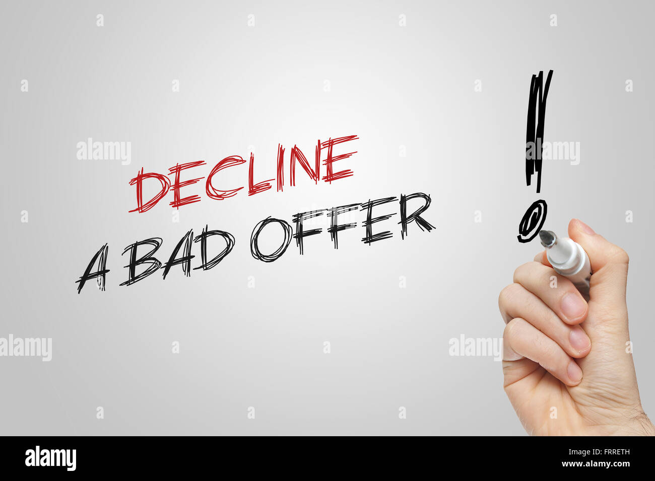 Hand writing decline a bad offer on grey background Stock Photo - Alamy