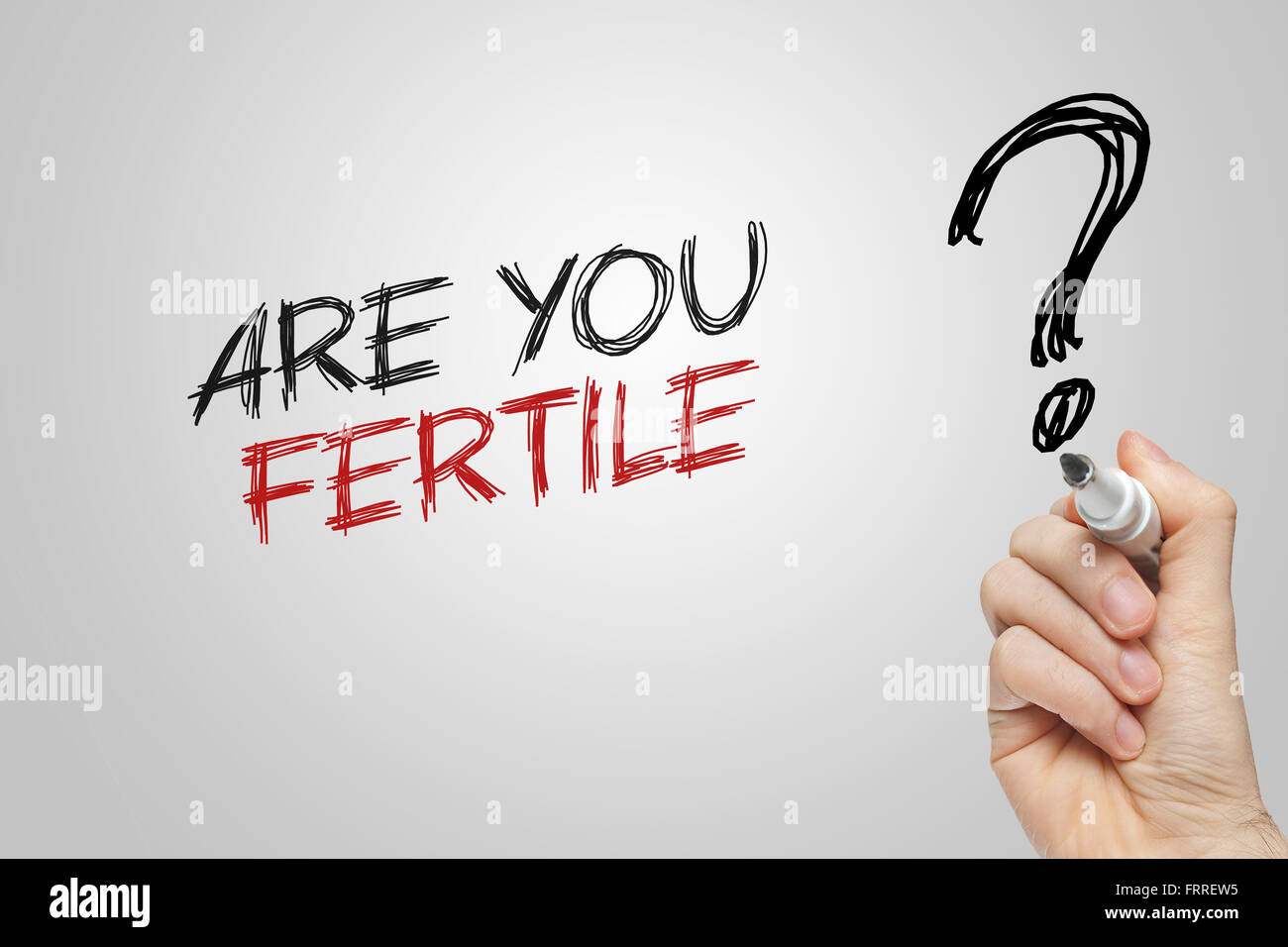 Hand writing are you fertile on grey background Stock Photo - Alamy