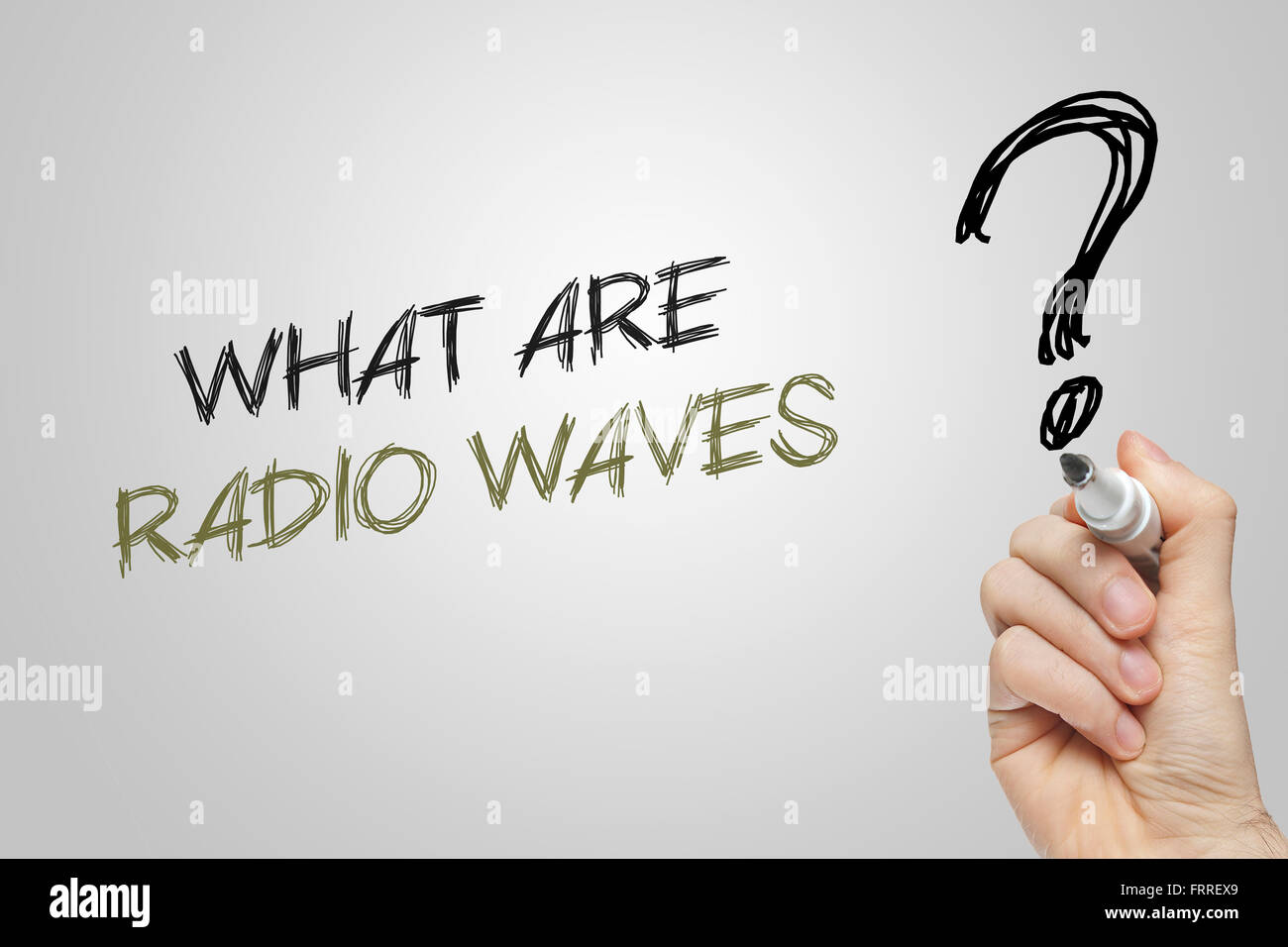 Hand writing what are radio waves on grey background Stock Photo - Alamy