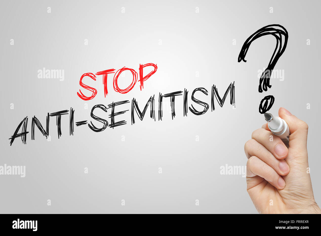 Hand writing stop antisemitism on grey background Stock Photo - Alamy
