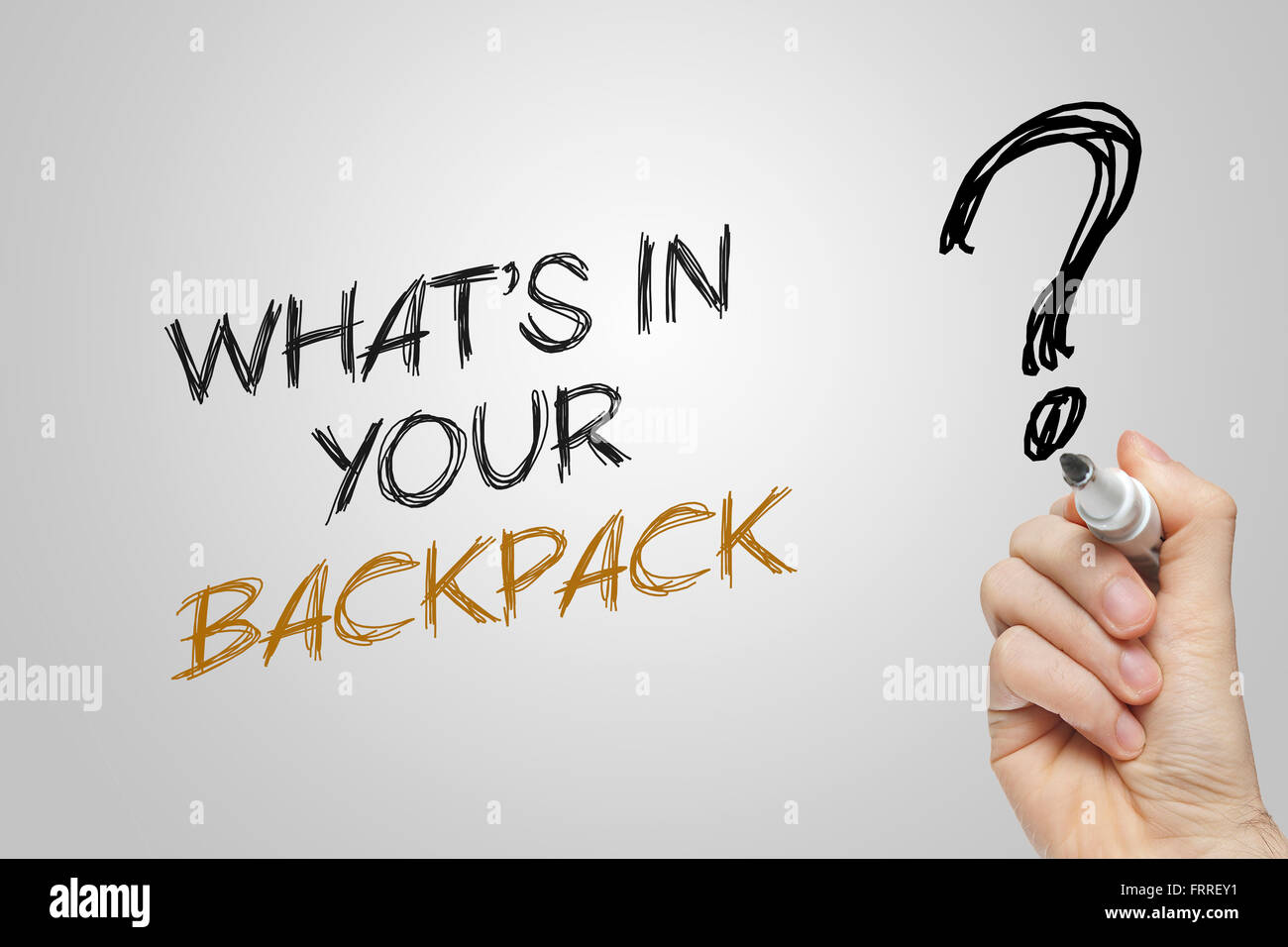 Hand writing whats in your backpack on grey background Stock Photo - Alamy