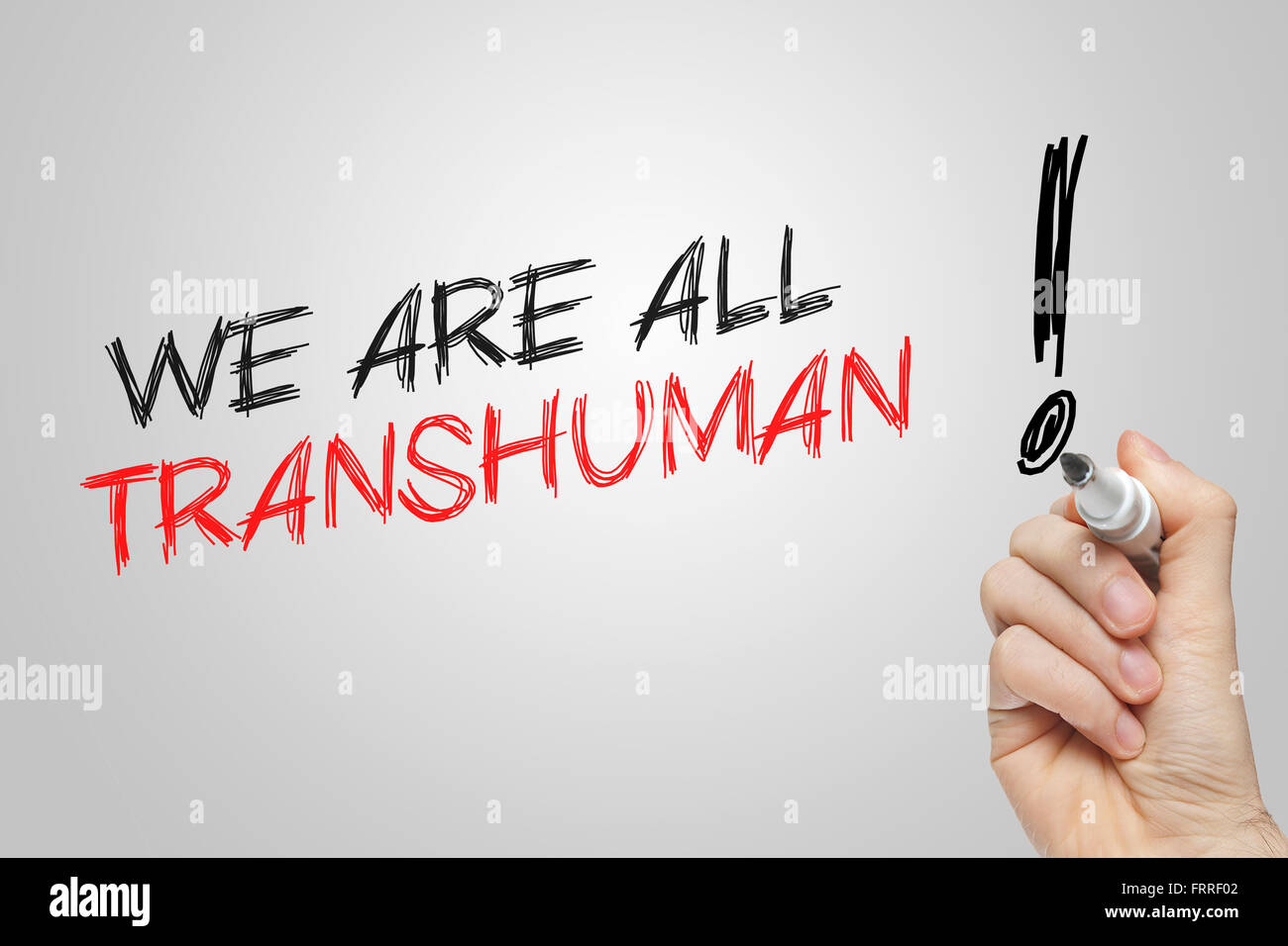 Hand writing we are all transhuman on grey background Stock Photo - Alamy