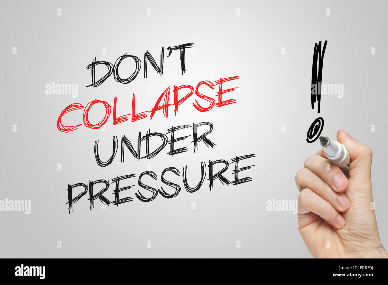 Hand writing don't collapse under pressure on grey background Stock ...