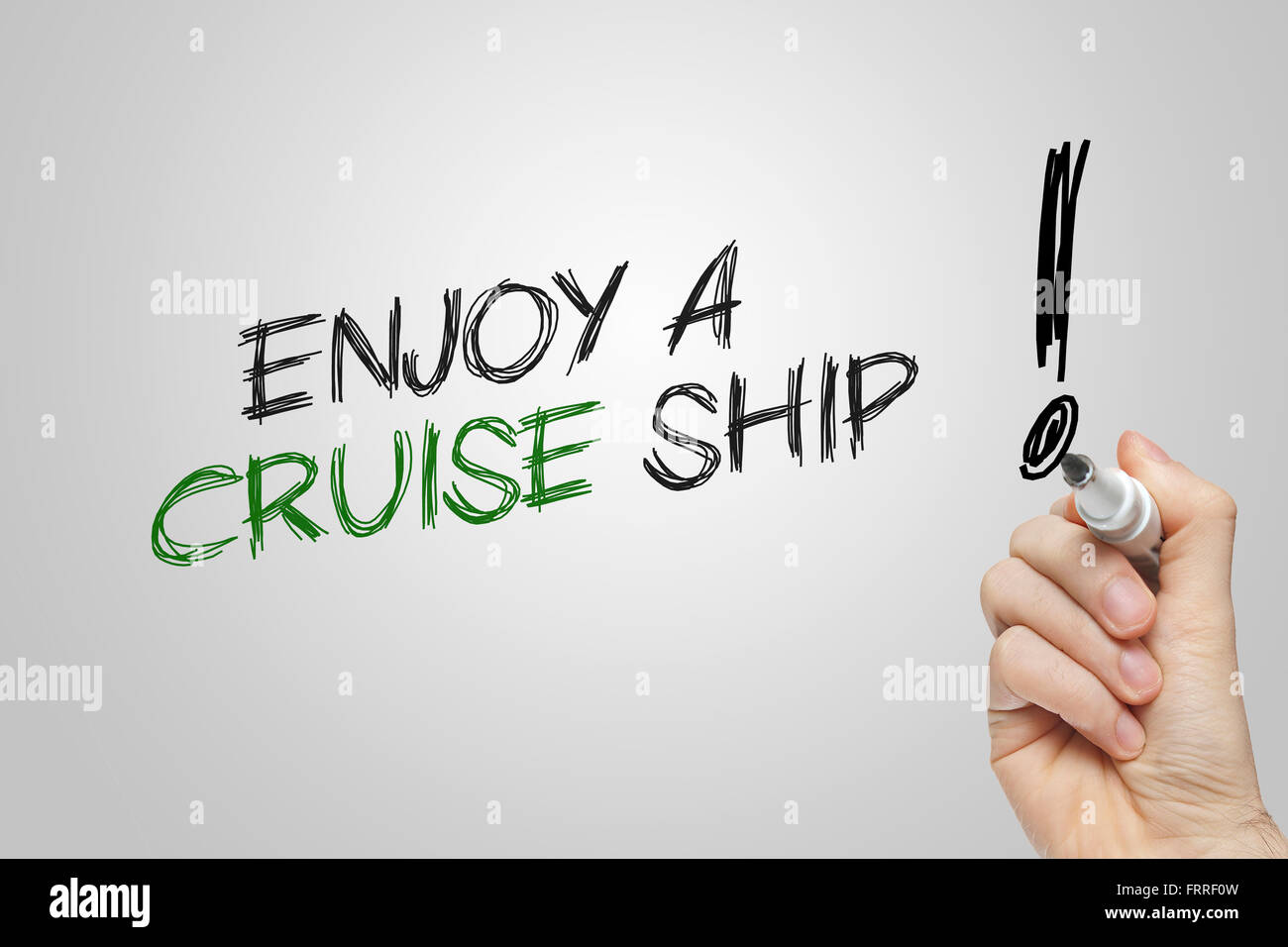 Hand writing enjoy a cruise ship on grey background Stock Photo - Alamy