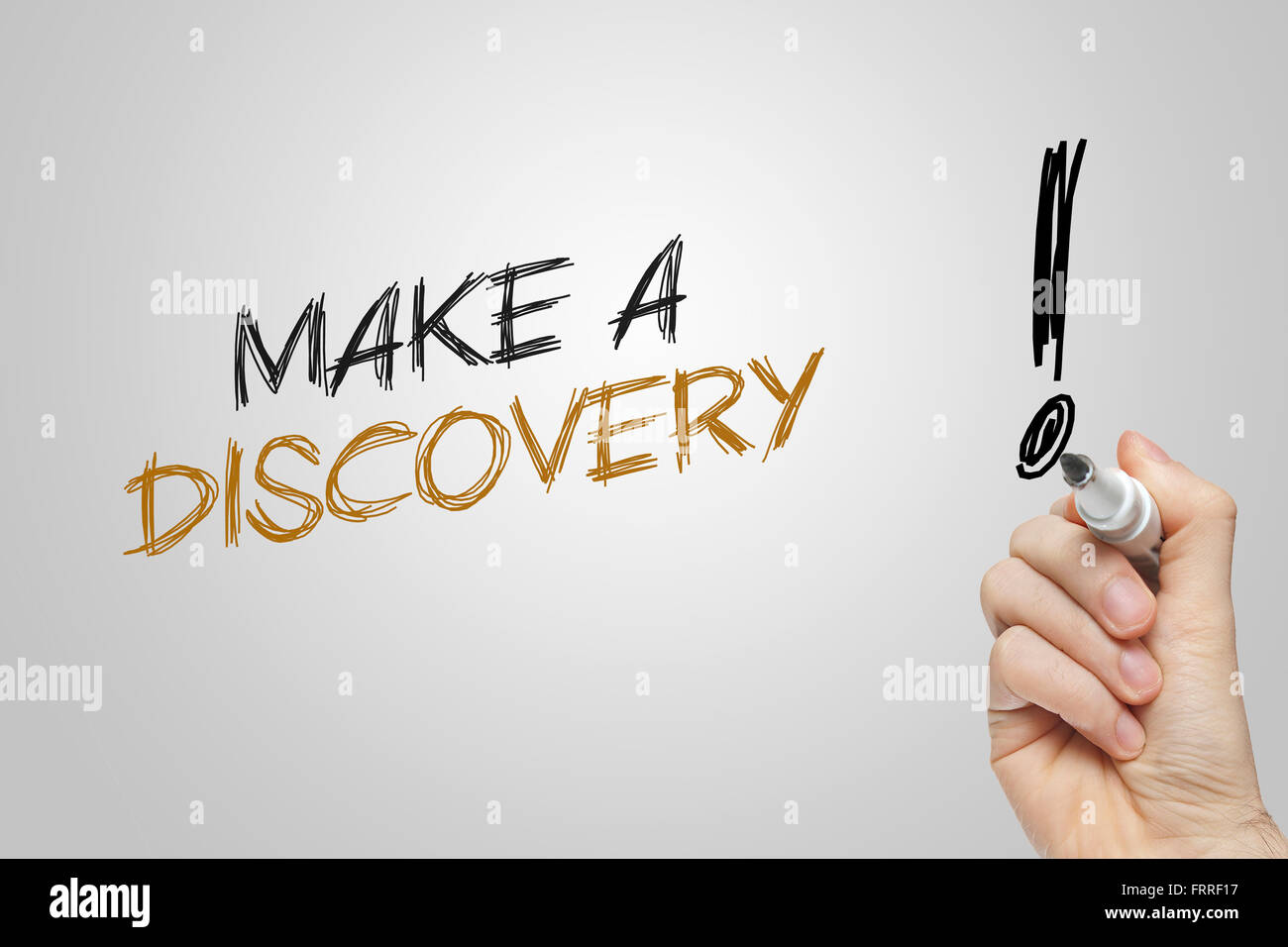 Hand writing discovery on grey background Stock Photo - Alamy