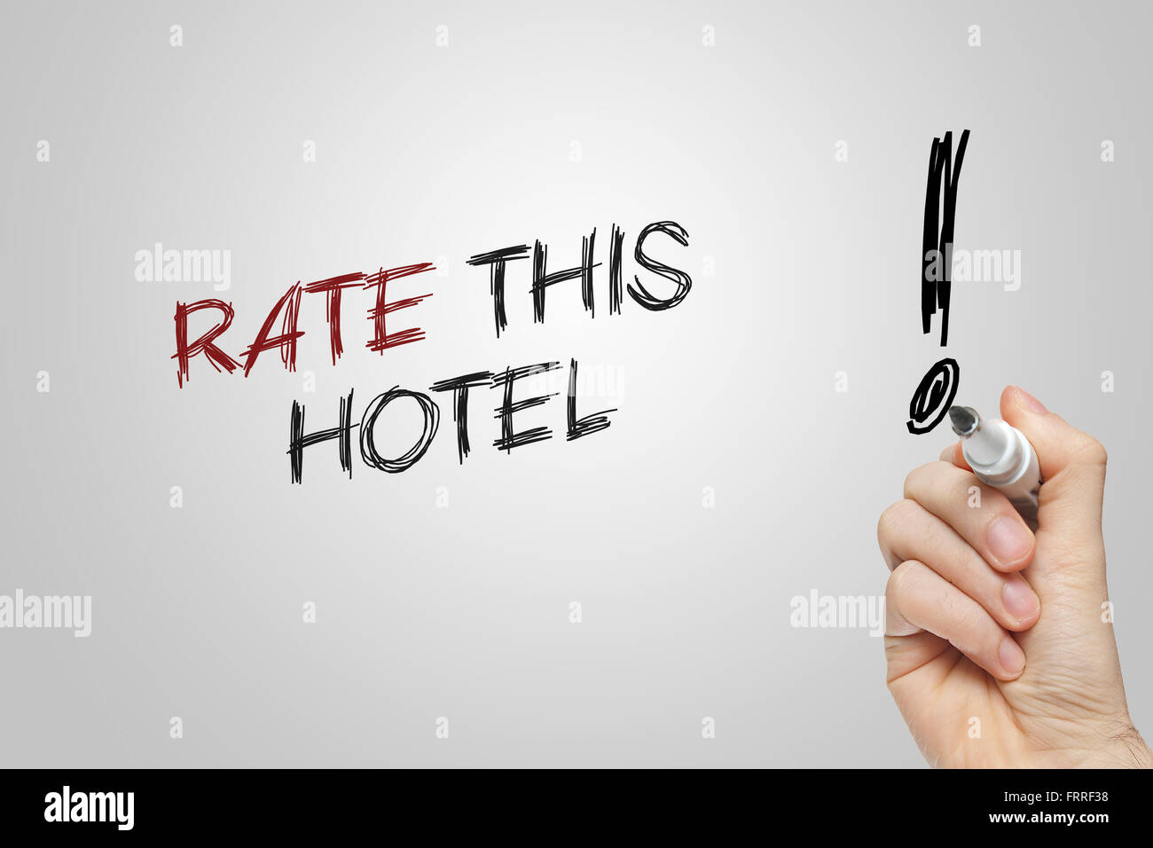Hand writing rate this hotel on grey background Stock Photo - Alamy