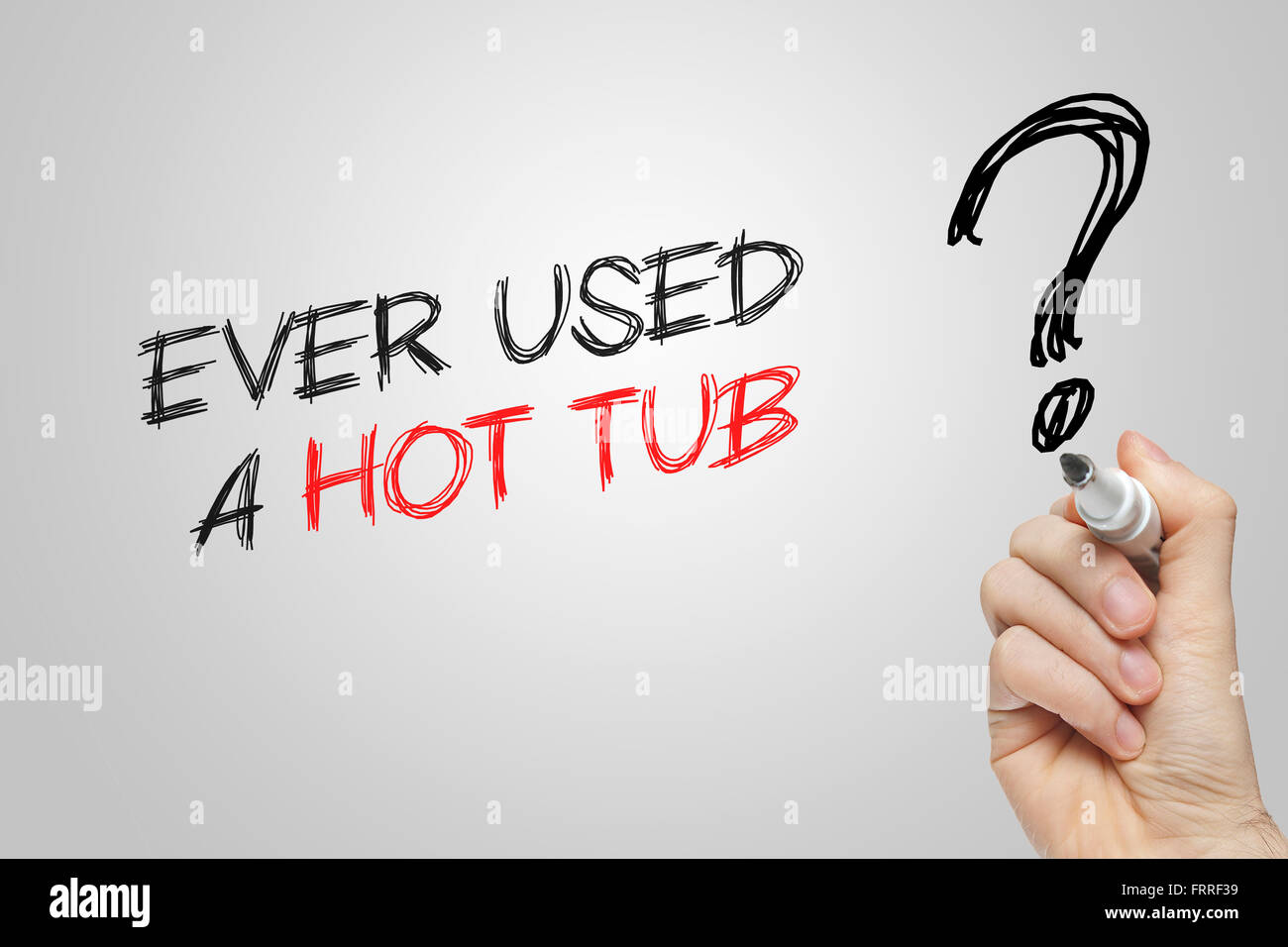 Hand writing ever used a hot tub on grey background Stock Photo - Alamy
