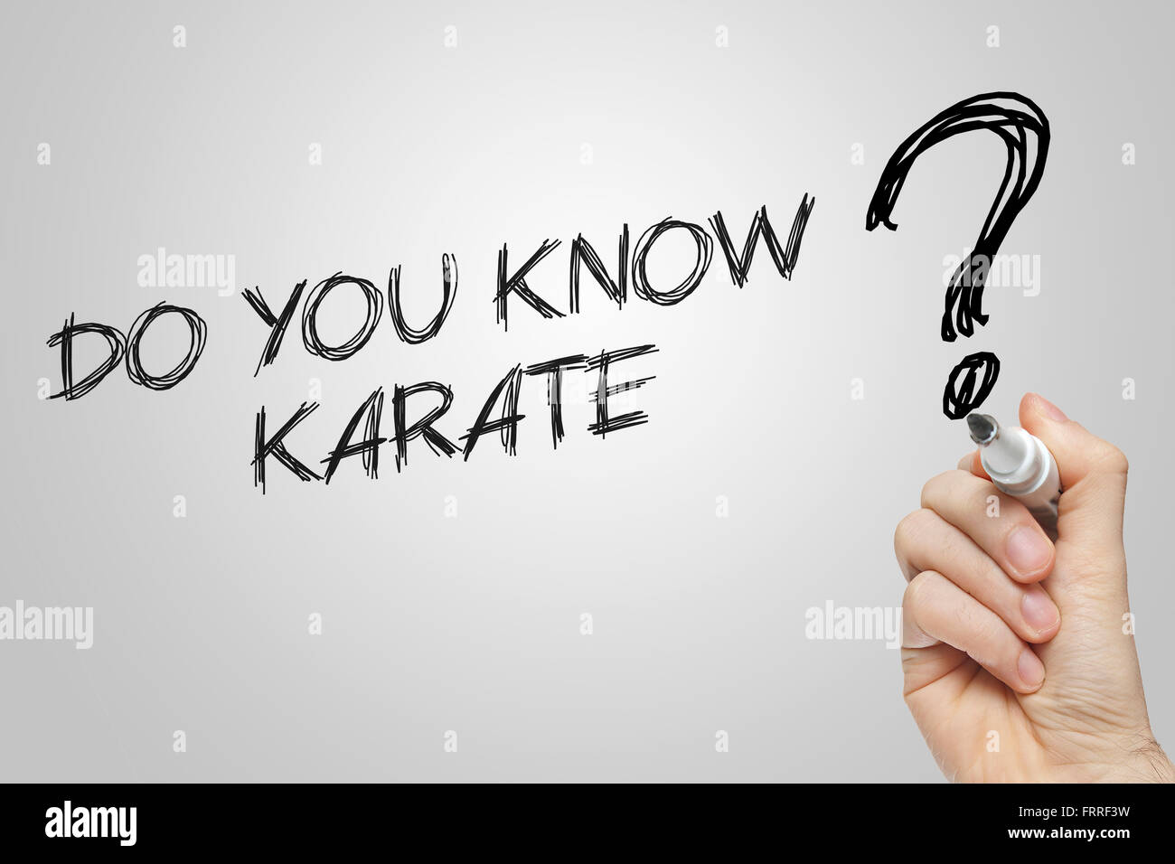 Hand writing do you know karate on grey background Stock Photo - Alamy