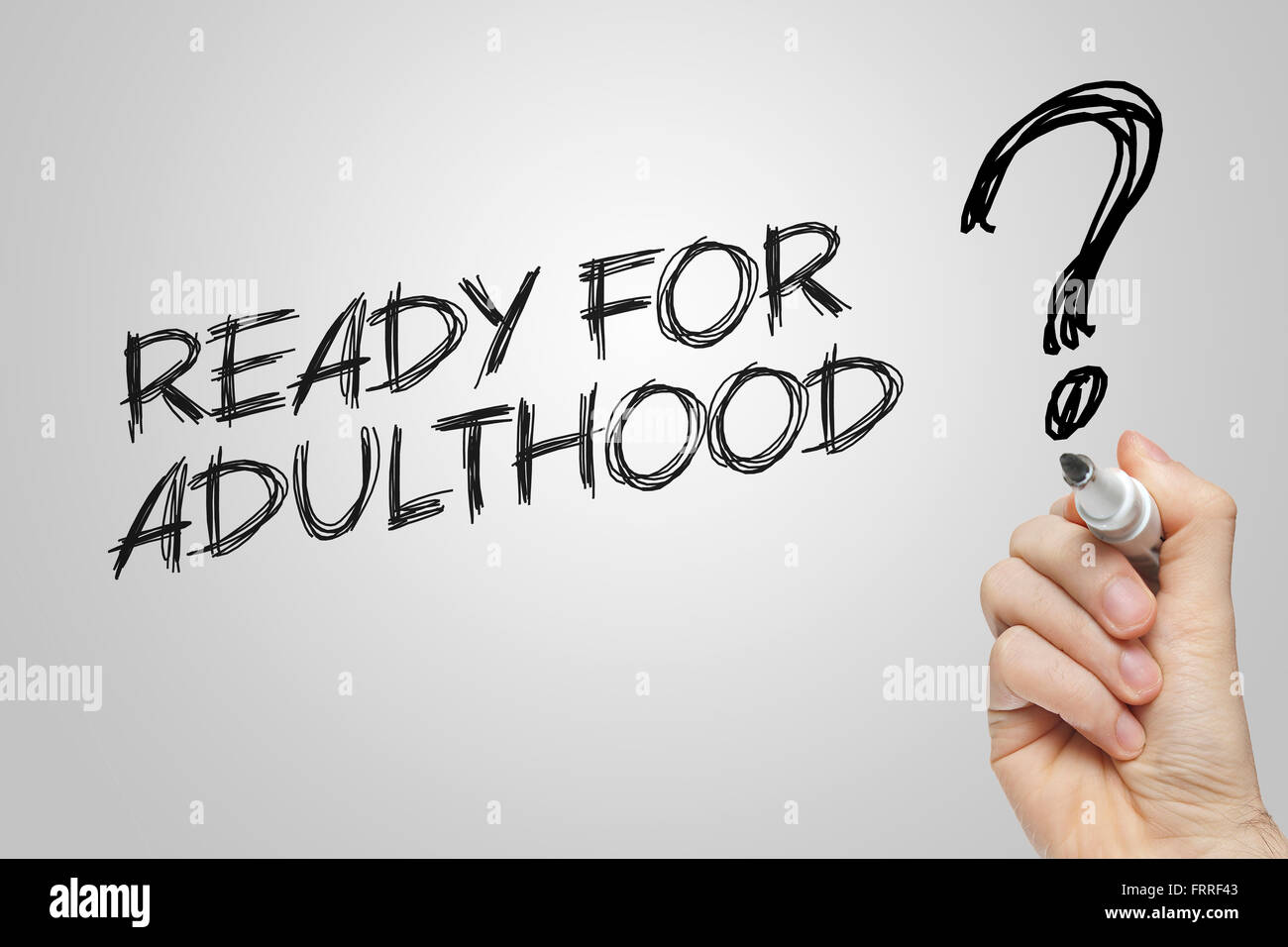 Hand writing ready for adulthood on grey background Stock Photo - Alamy