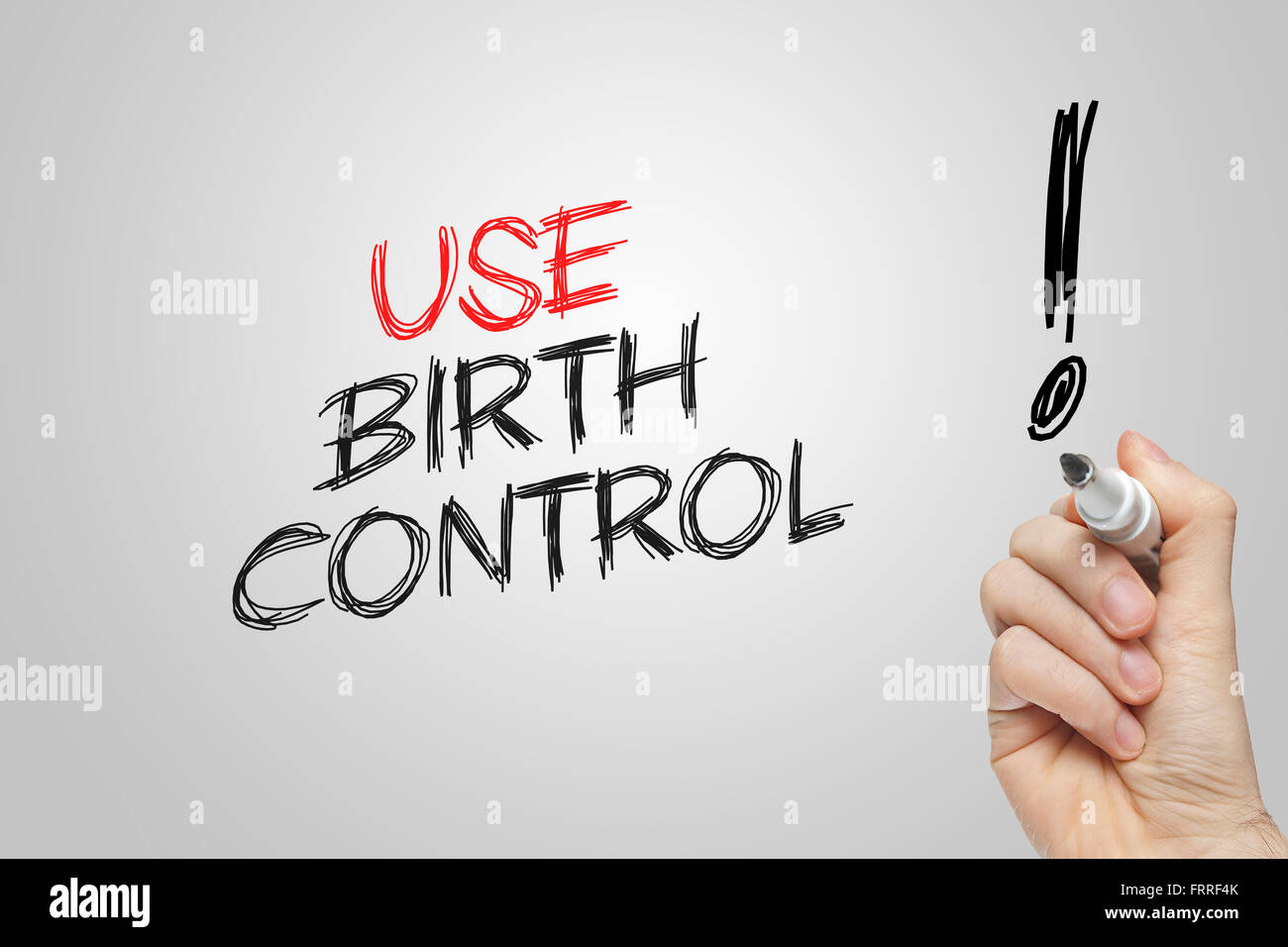 Hand writing use birth control on grey background Stock Photo - Alamy