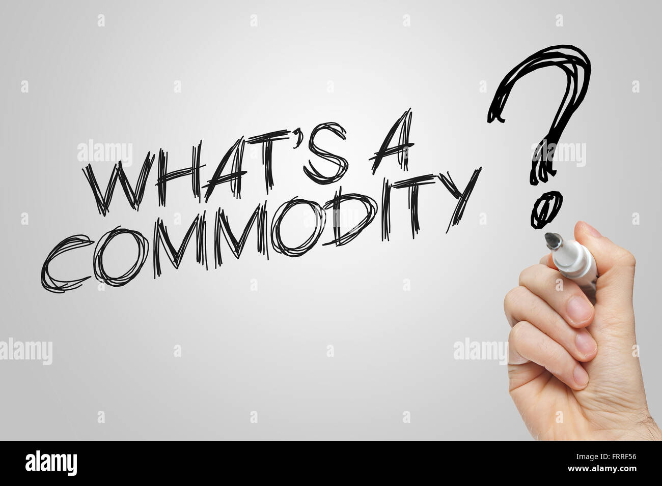 Hand writing commodity on grey background Stock Photo - Alamy