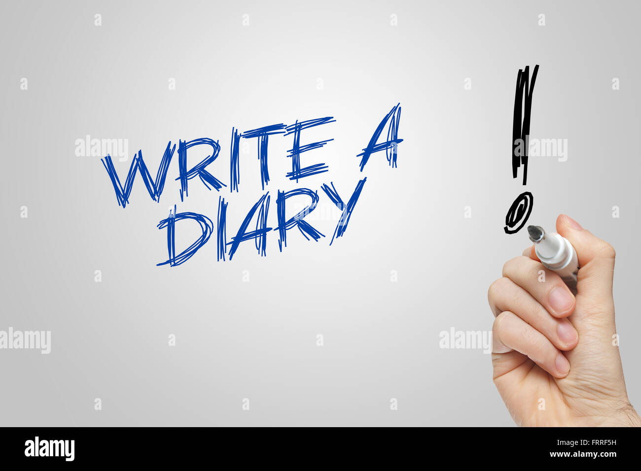 Hand writing write a diary on grey background Stock Photo - Alamy