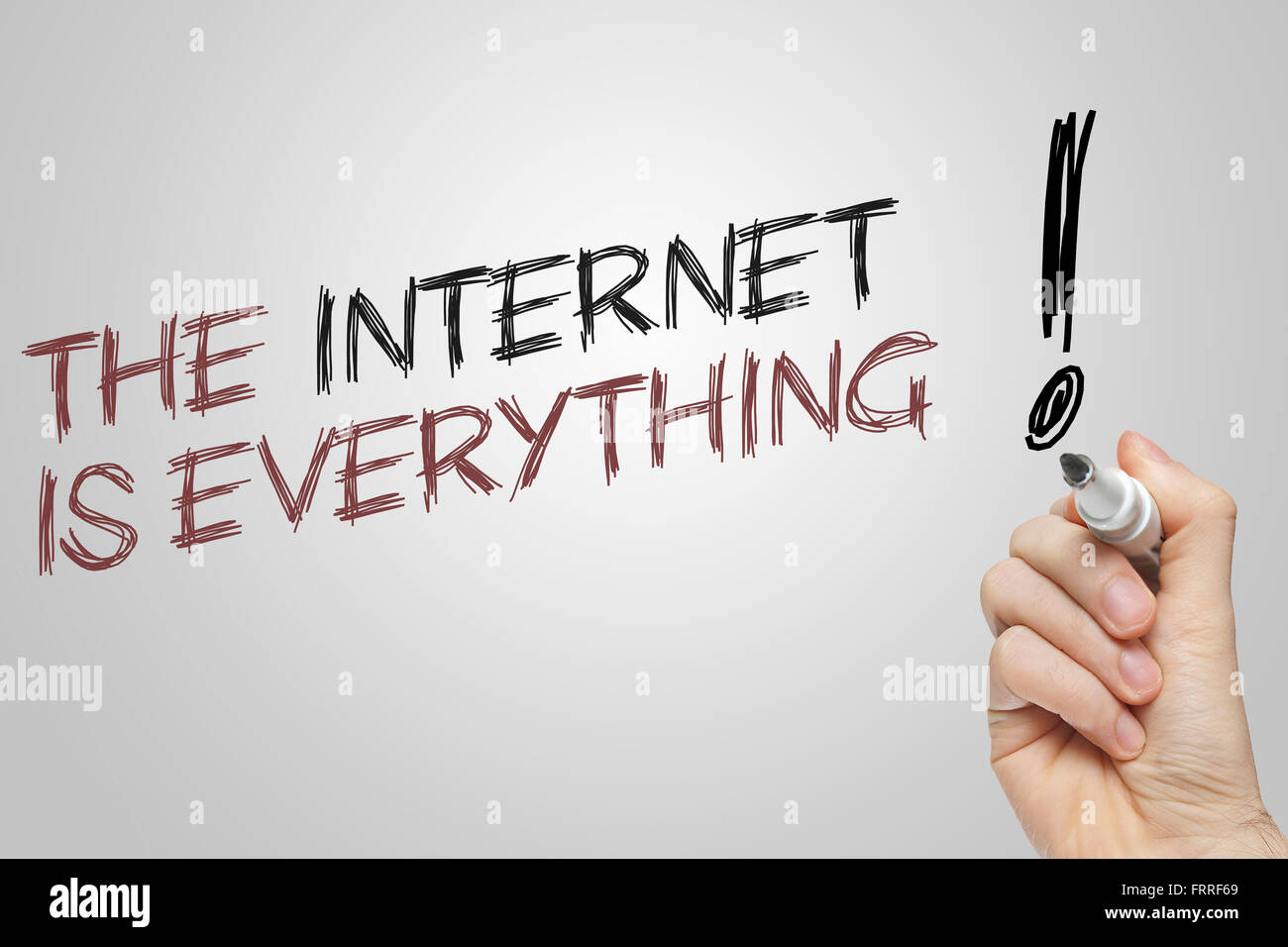 Hand writing the internet is everything on grey background Stock Photo ...