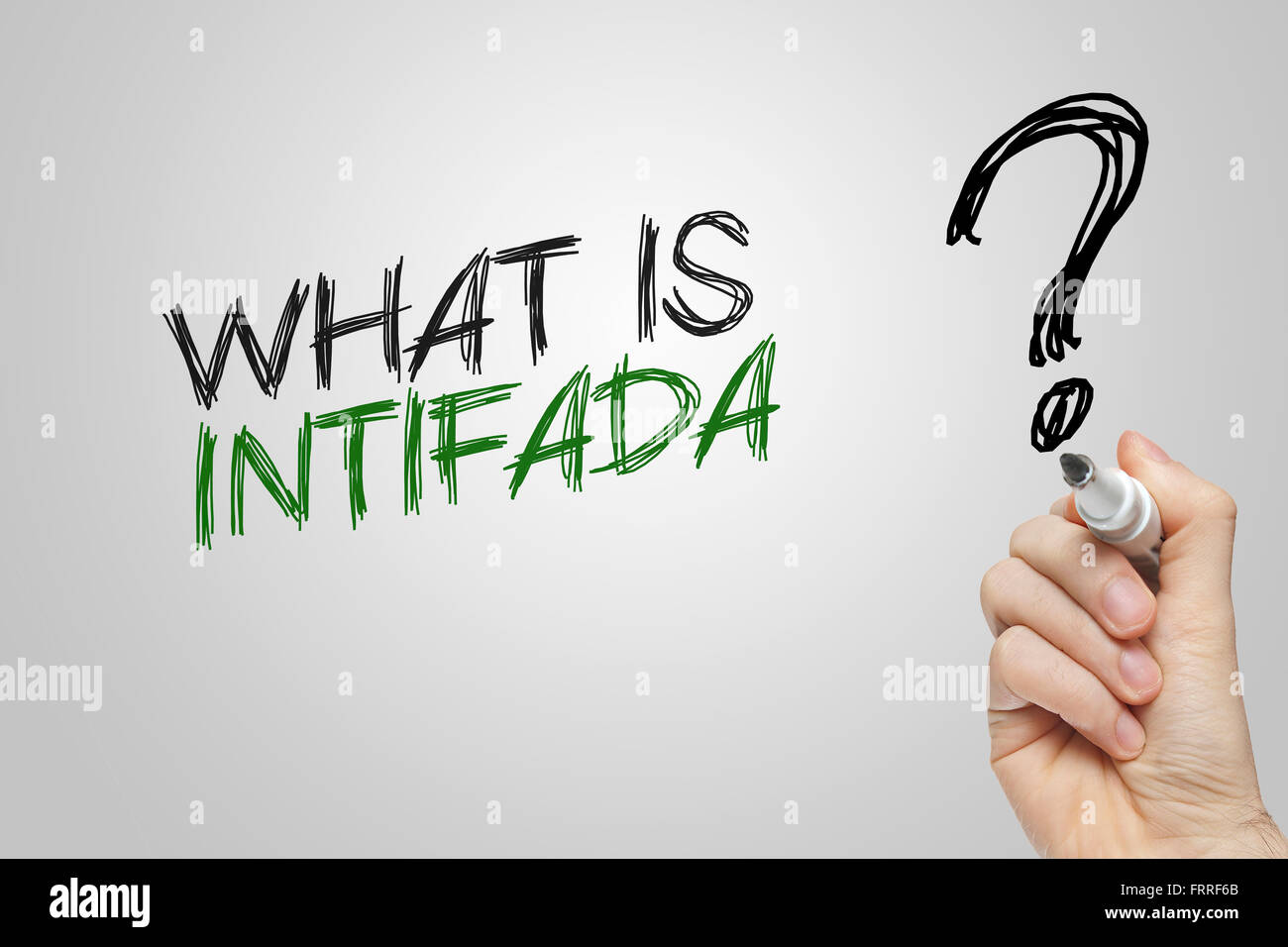 Hand writing what is intifada on grey background Stock Photo - Alamy