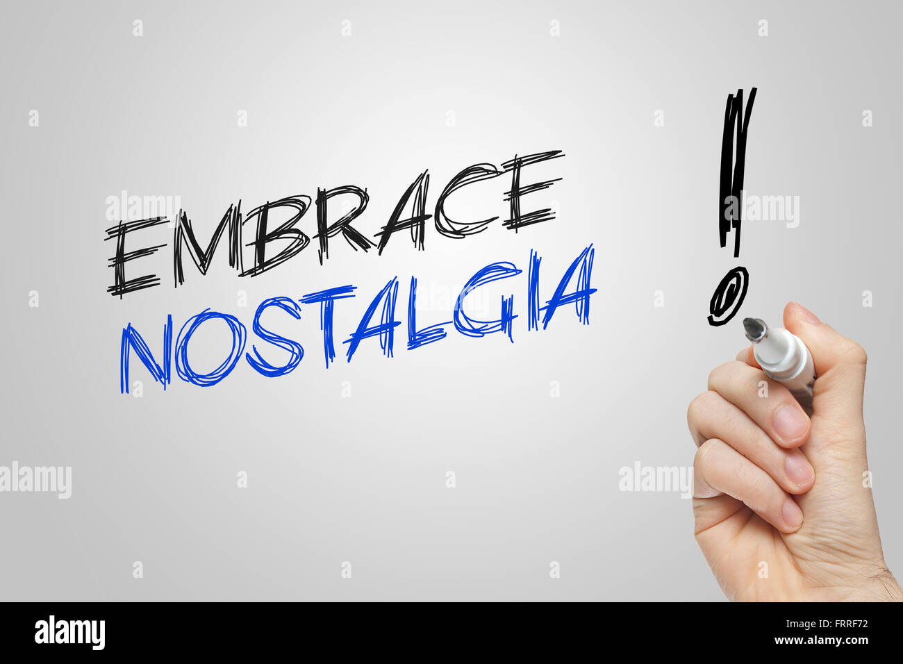 Hand writing embrace nostalgia on grey background Stock Photo - Alamy
