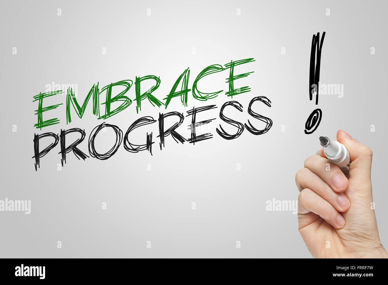 Hand writing embrace progress on grey background Stock Photo - Alamy