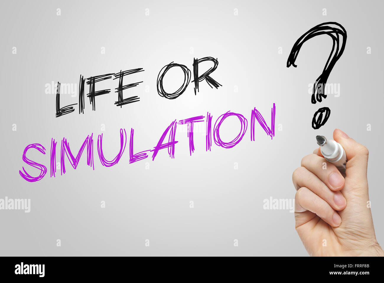 Hand writing life or simulation on grey background Stock Photo - Alamy