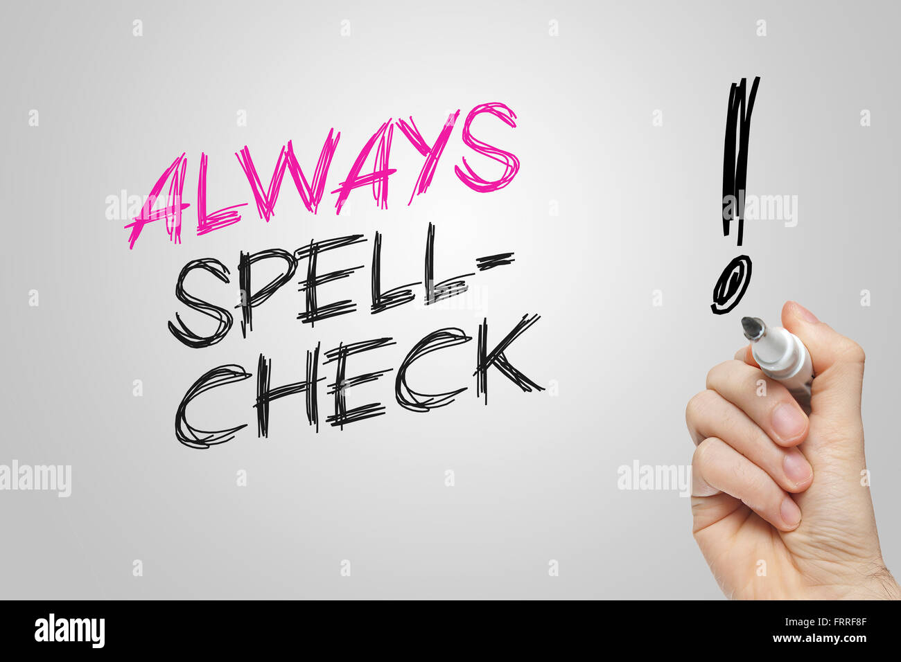 Hand writing always spellcheck on grey background Stock Photo - Alamy