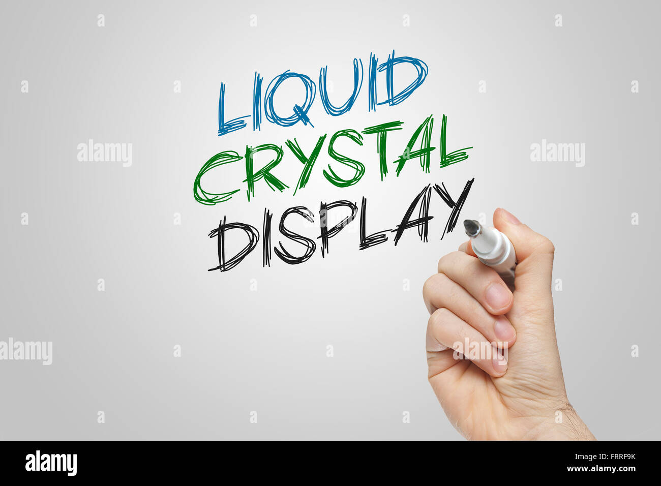 Hand writing liquid crystal display on grey background Stock Photo - Alamy