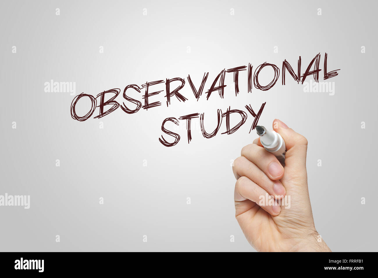 Hand writing observational study on grey background Stock Photo - Alamy