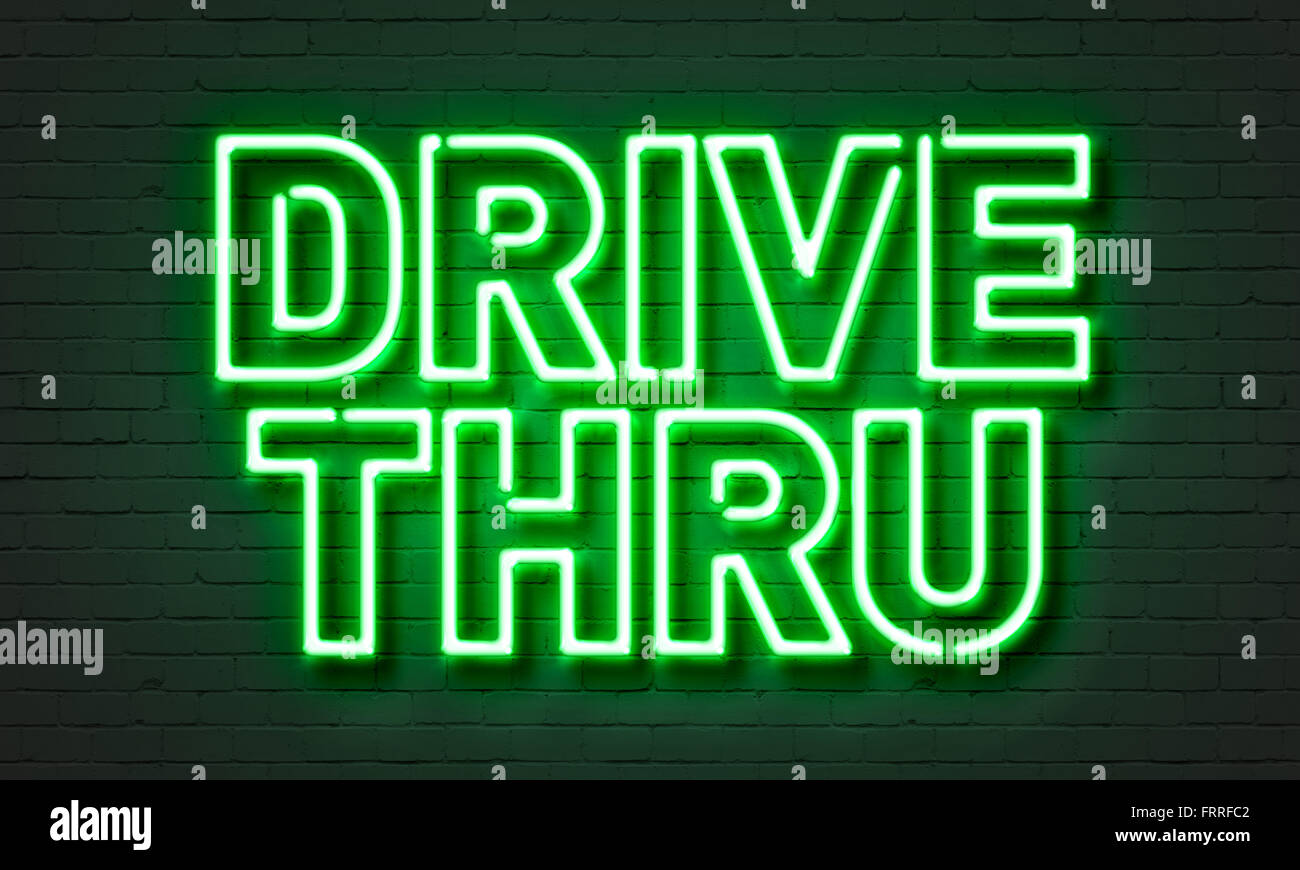 Drive thru neon sign on brick wall background Stock Photo - Alamy