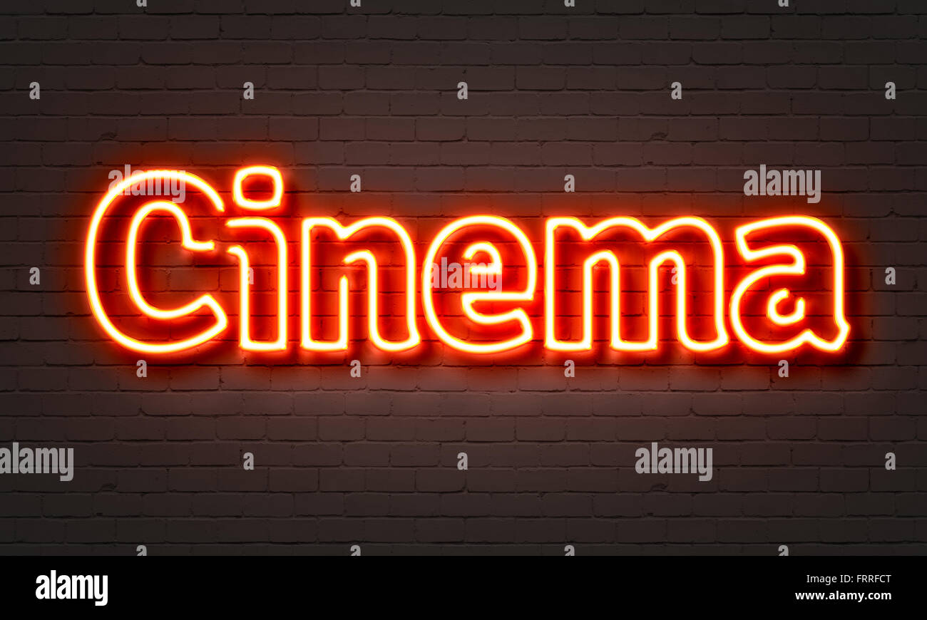 Cinema neon sign on brick wall background Stock Photo - Alamy