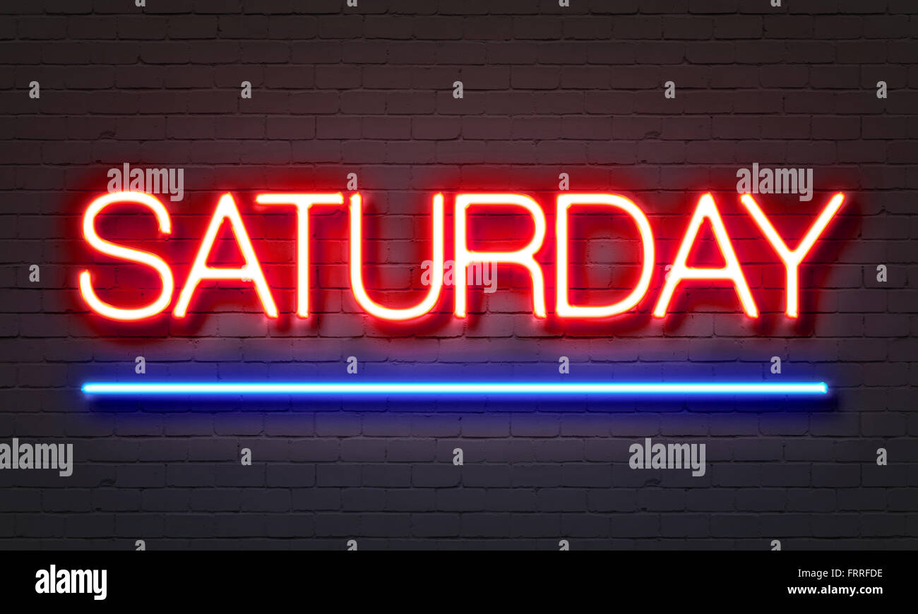 Saturday neon sign glowing on club wall with bricks Stock Photo - Alamy