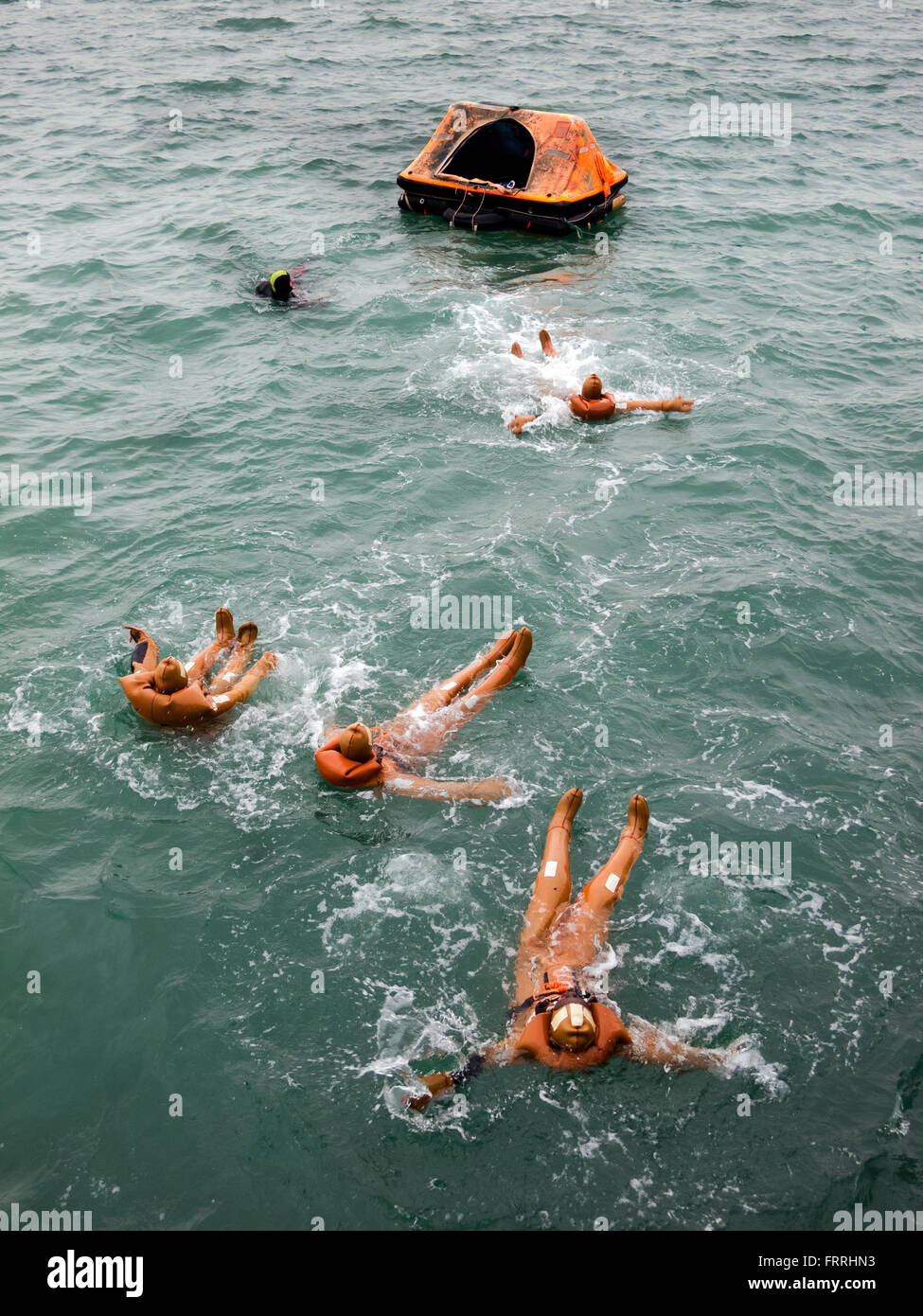 LIFEBOAT IN THE SEA AFTER A SHIPWRECK WITH FIVE FISHERS DRESSED WITH ...