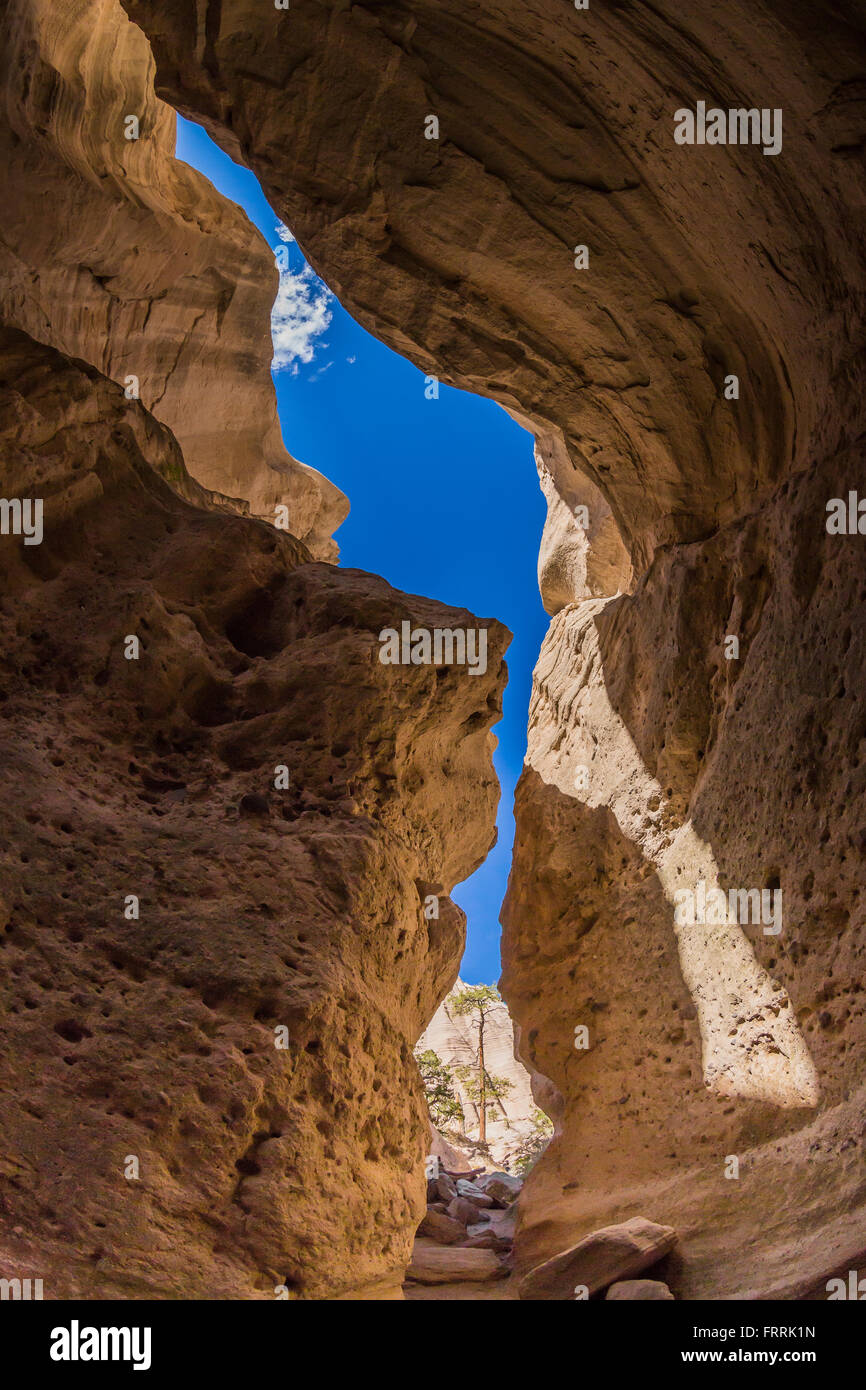 Hiking through the narrow slot canyon along the Slot Canyon Trail at ...