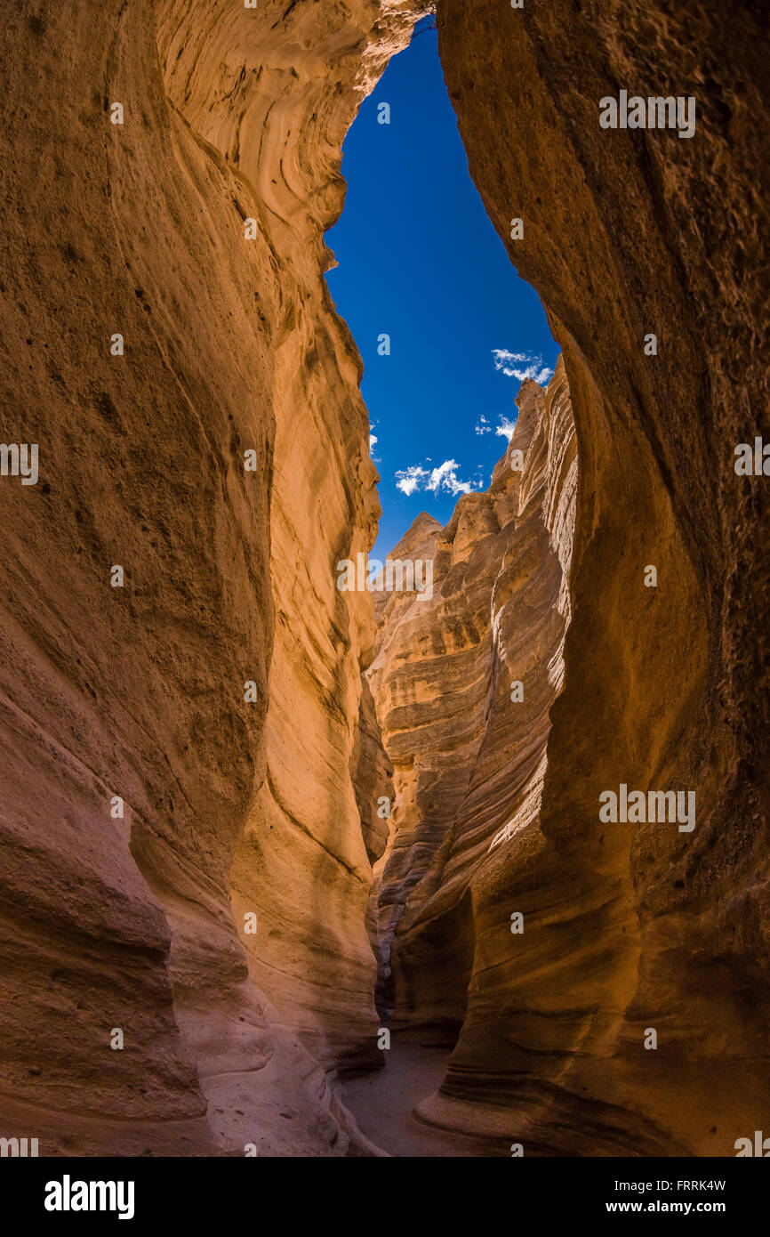 Hiking through the narrow slot canyon along the Slot Canyon Trail at ...