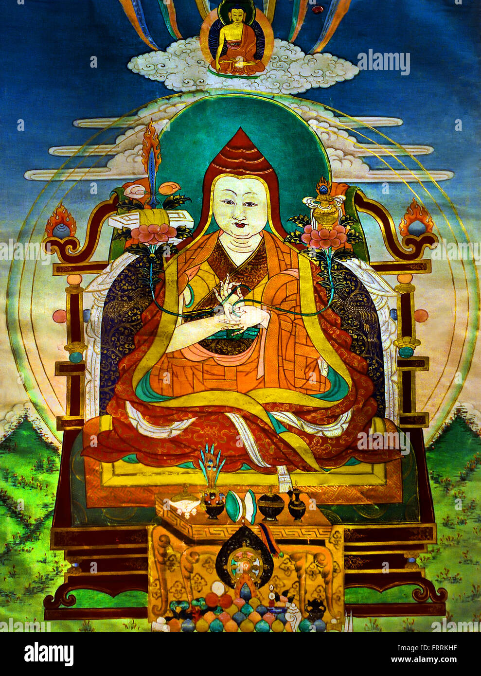 This scroll painting, thangka, shows a teacher, Lama, on a throne with ...