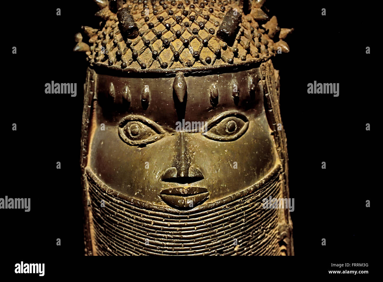 Head of a King ( Oba ) with three tattoos above the eyes and a hat and ...